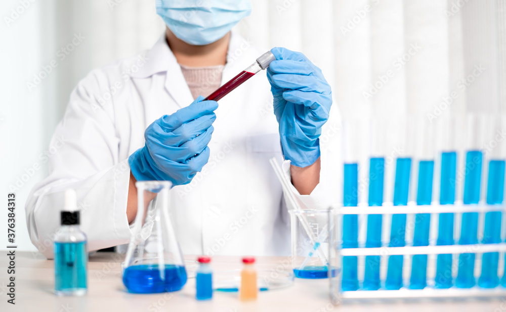 Professional doctors perform find virus tests from samples of blood ...