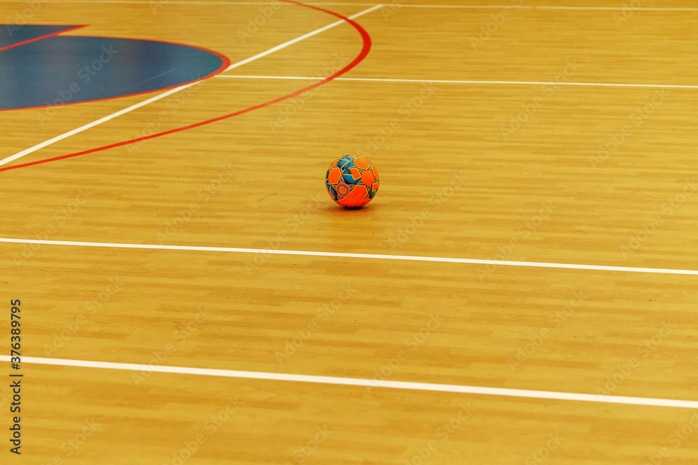 Gym for playing futsal, mini-football. Folded wooden parquet on the ...