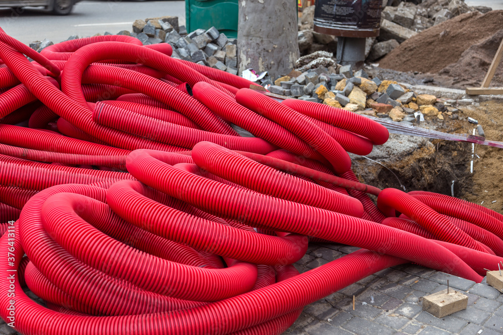 Colorful abstract plastic pipes on construction site. The concept of ...