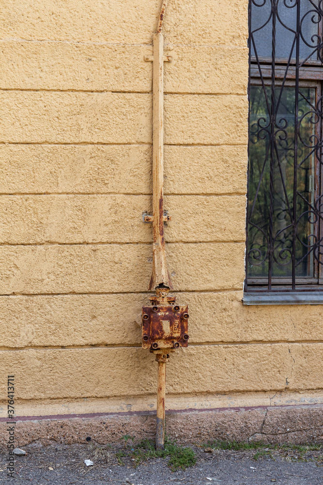 An antique vintage entry of electrical wires into the building. Putting ...