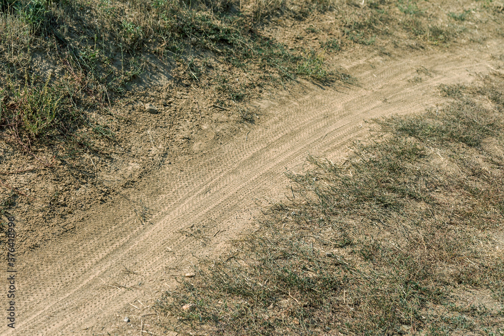 bike bus print in dust of dirt track of race track for cyclists ...