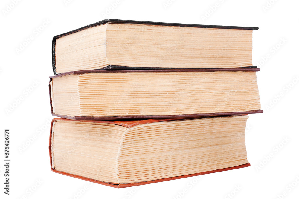 Three closed old thick paper books with yellow pages white background ...