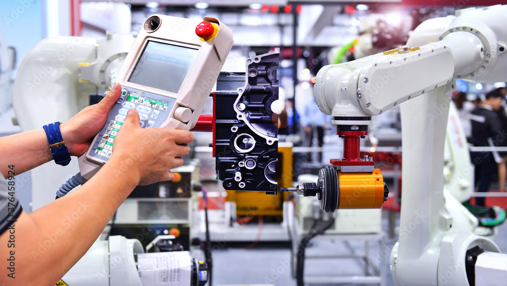 Engineer control automation Robot arm machine for assembling engines in ...