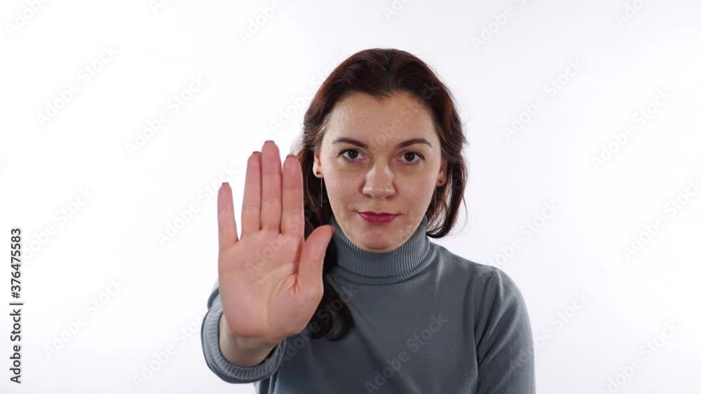 Stop hand sign. Woman shows stop hand gesture meaning something or ... Stop hand sign. Woman shows stop hand gesture meaning something or ...