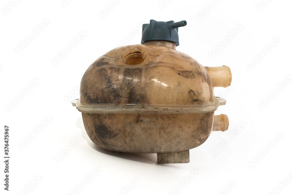 Old and worn rounded car coolant expansion tank on a white background ...