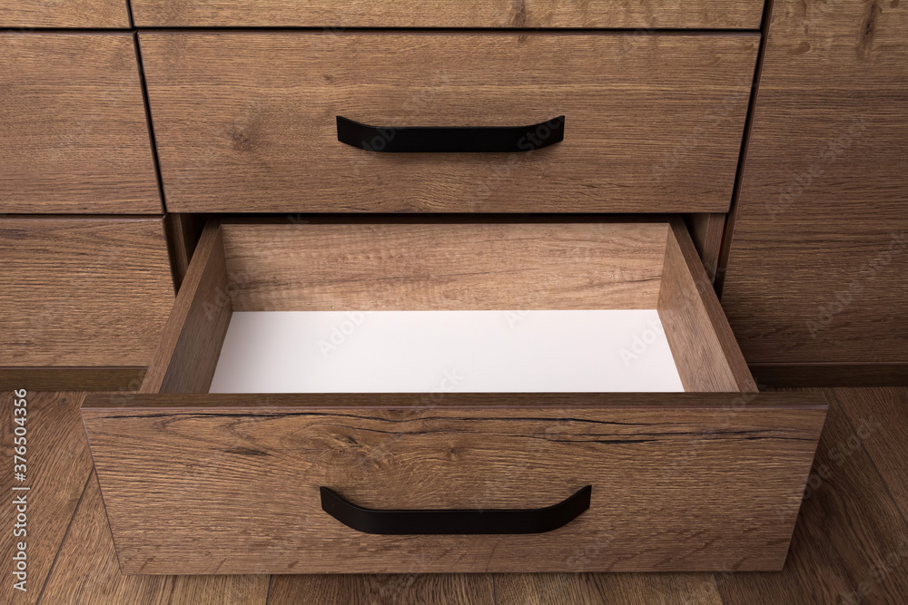 Empty open wooden drawer. Storage box. Stock Photo | Adobe Stock