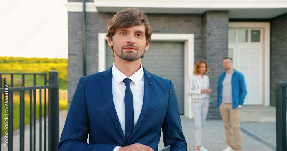 Vidéo Stock Portrait Caucasian handsome male real-estate agent in suit ...