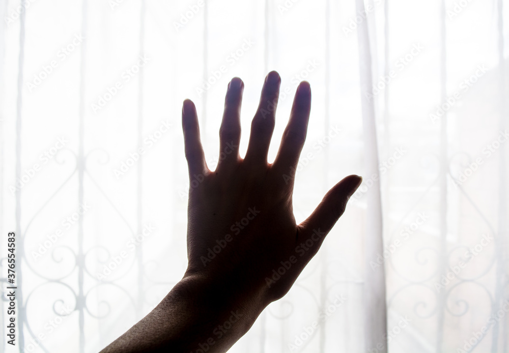 Hand and arm silhouette backlight with a natural white light from de ...
