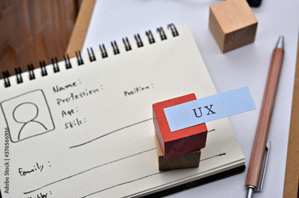 A note with the user's persona written on it is placed on a clipboard ...