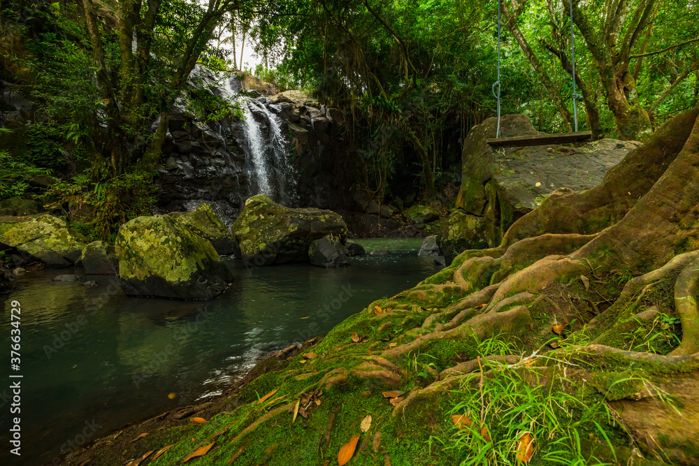 Waterfall landscape. Beautiful hidden waterfall in tropical rainforest ...
