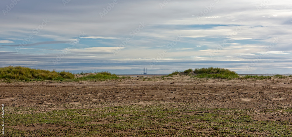 A floating Jack Up Oil Rig waiting out in the North Sea for High Tide ...
