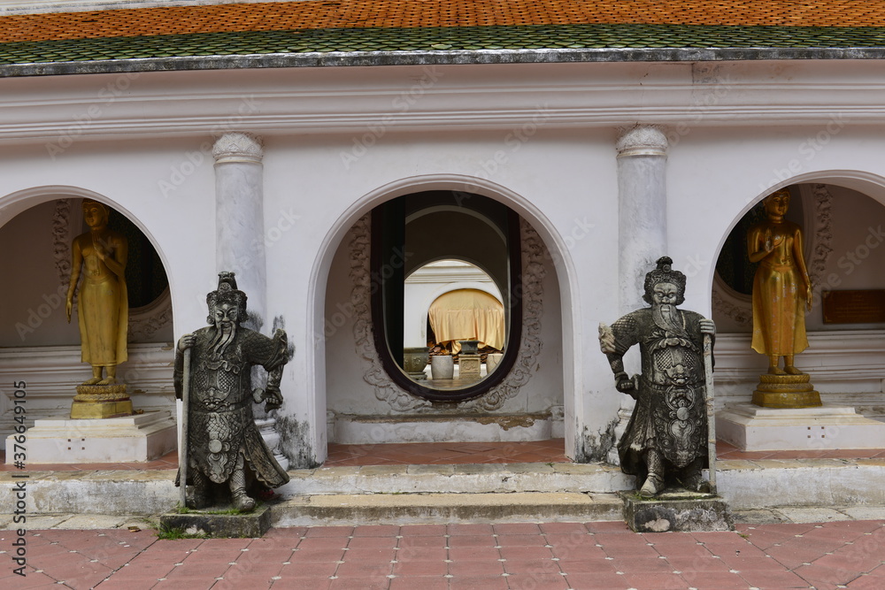 The Ancient Chinese warrior sculpture statue around Golden pagoda Phra ...