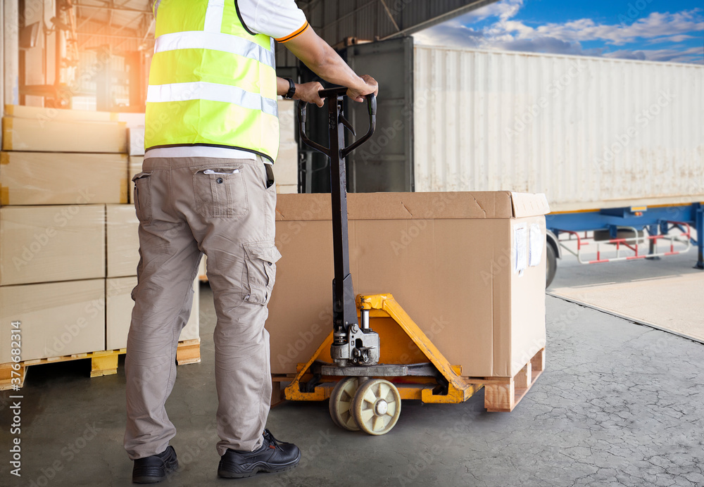 Workers Unloading Packaging Boxes on Pallets to The Cargo Container ...