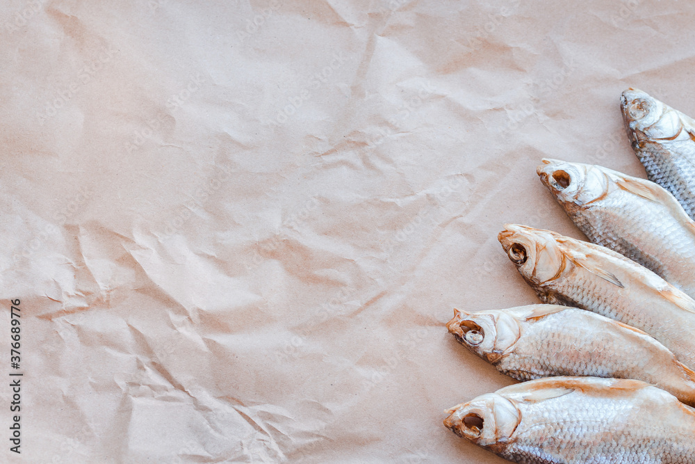 Dried fishes template banner on craft paper background with empty space ...