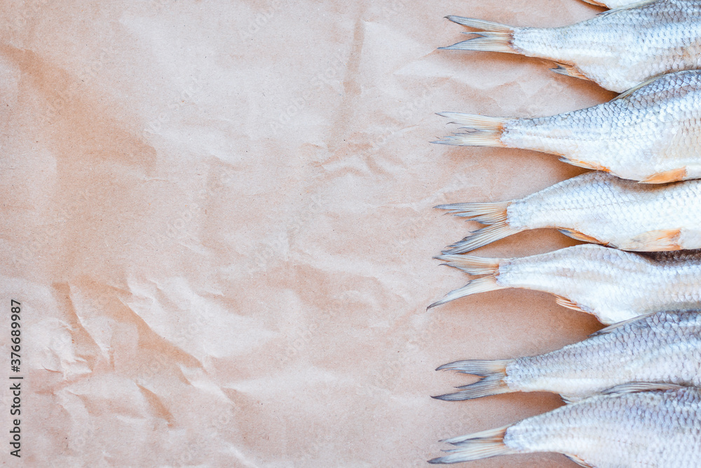 Dried fishes template banner on craft paper background with empty space ...