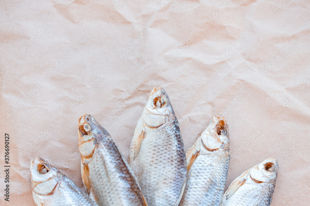 Dried fishes template banner on craft paper background with empty space ...