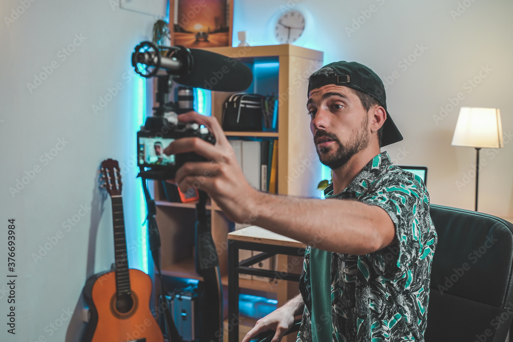 Behind the scene shot of a young man influencer making a video. Very ...