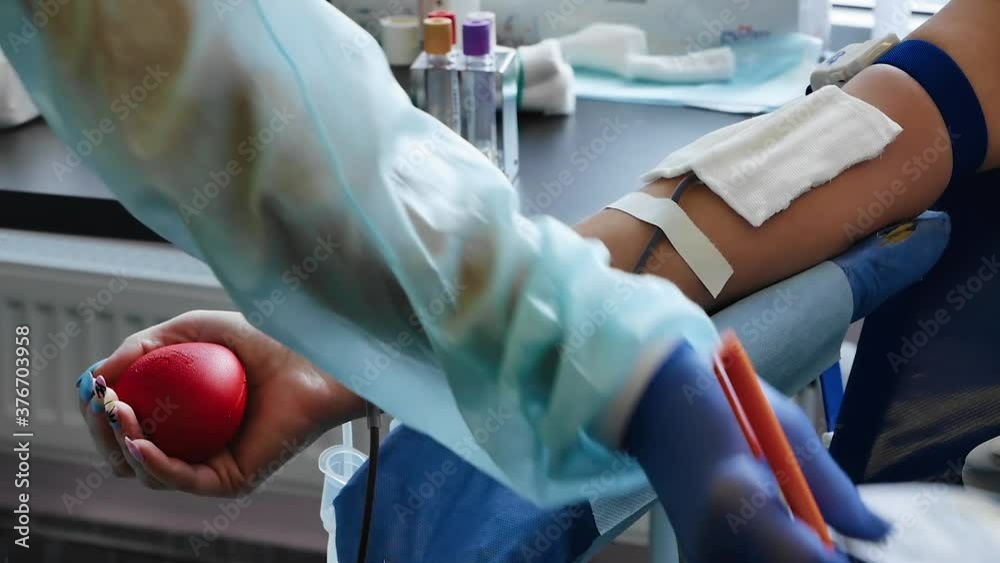 The girl squeezes a rubber bulb by hand pumping blood pressure. Blood ...