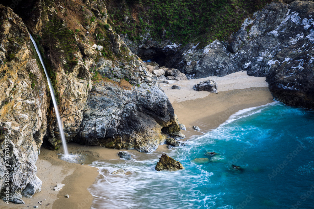 McWay Falls spilling in Pacific Ocean Stock Photo | Adobe Stock