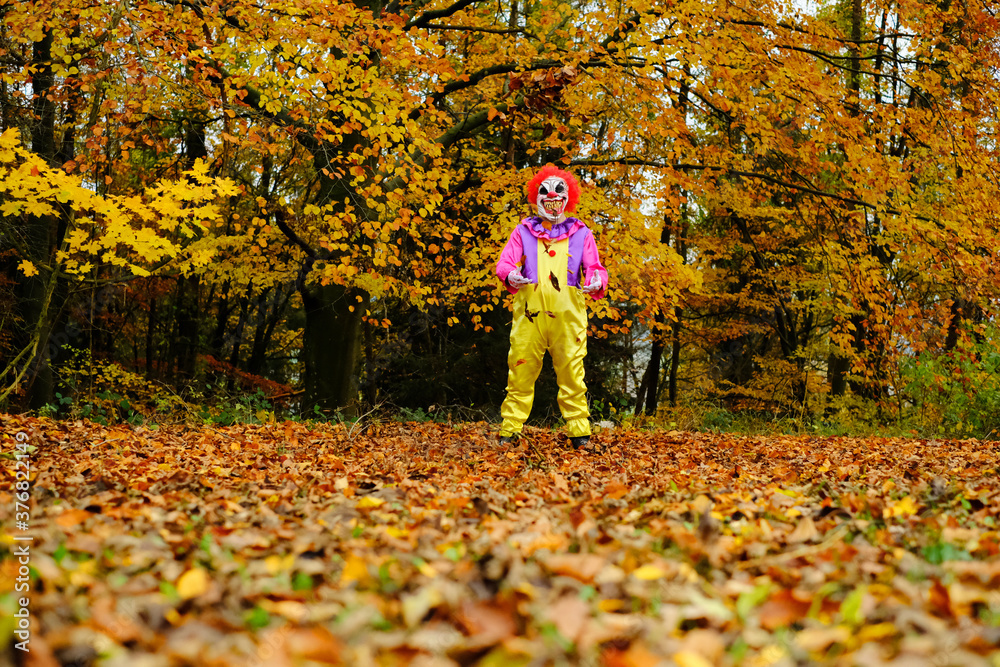 Halloween festive carnival.Halloween masquerade party.A scary clown ...