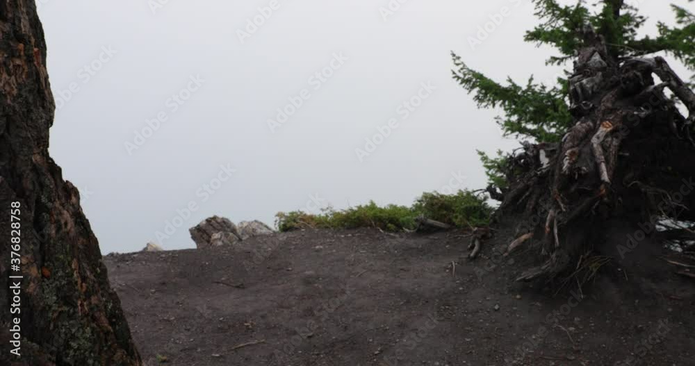 walking up to the edge of the Bastion mountain cliff and looking off ...