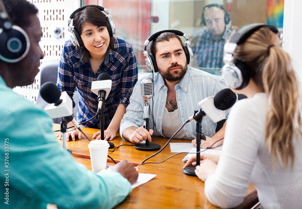 Scandal interview. Two young outraged guests answering provocative ...