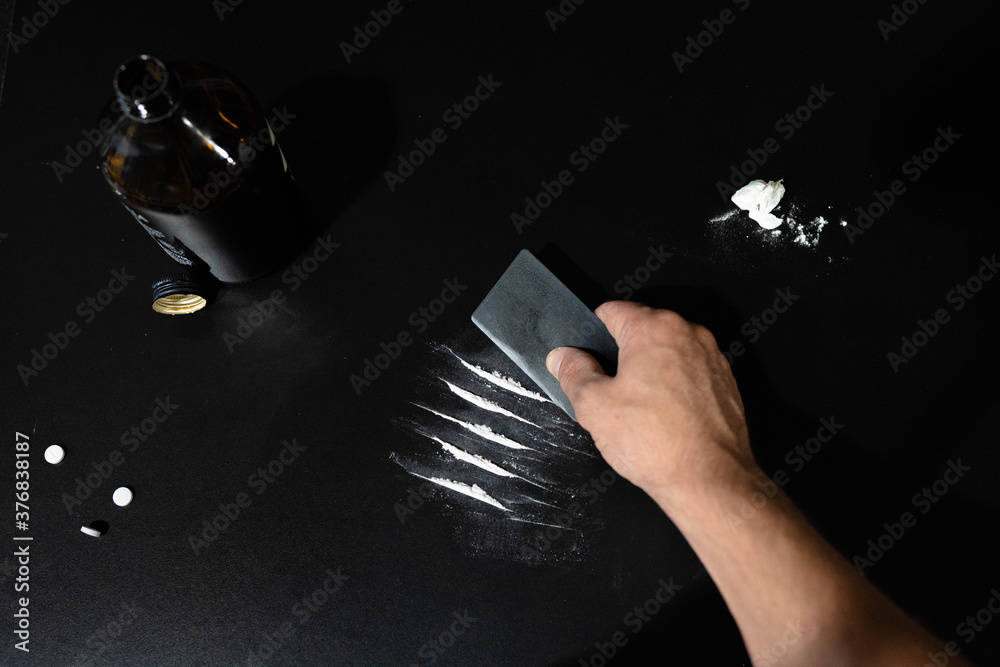 Drug. Cocaine, Money, alcohol, on the table Sniffs Line of cocaine ...