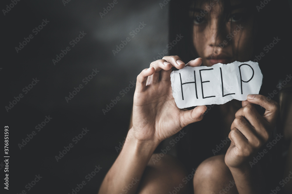 Women sitting alone with depressed expression and showing a paper with ...