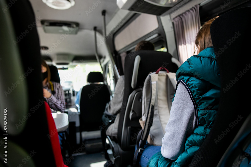 People sitting on seat in back view on the bus Stock Photo | Adobe Stock