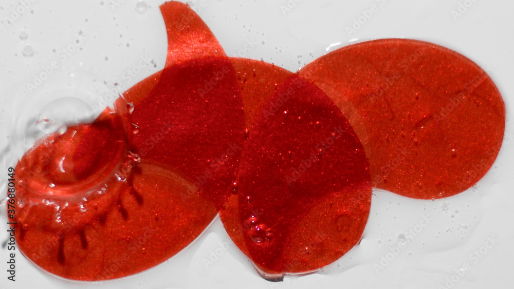 red under eye patches and a liquid serum pouring on it from above. Top ...