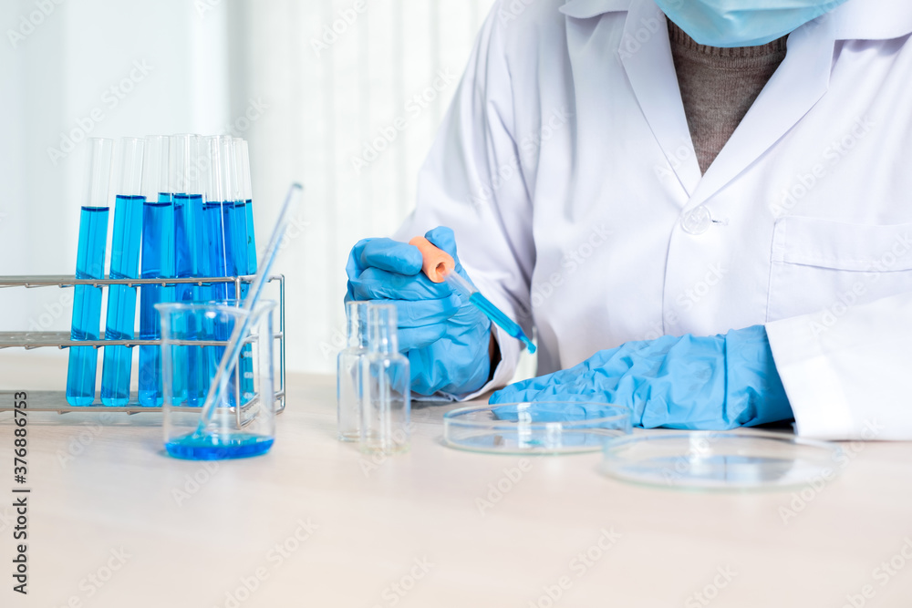 Medical scientists released a sample pipetted into test glassware to ...