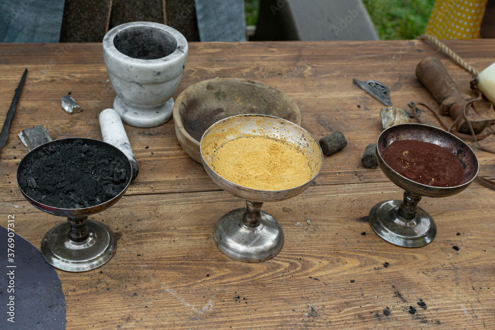 charcoal, sulfur, saltpeter in bowls for making black powder. Сasting ...