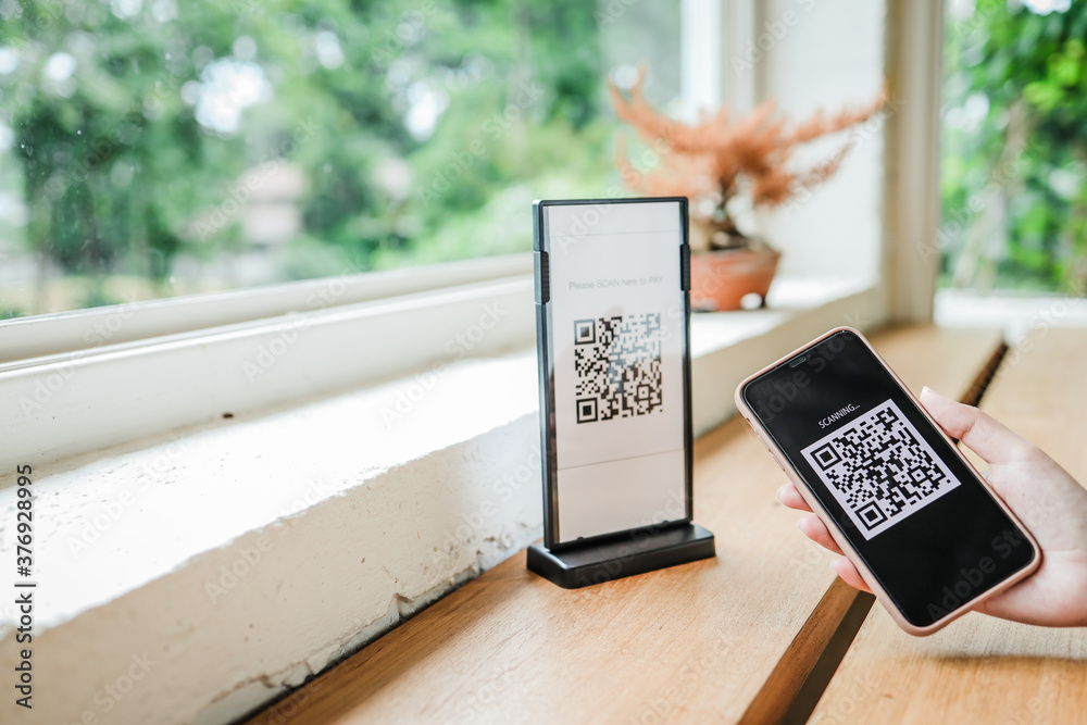 E wallet Qr code payment. Woman scanning QR code online shopping ...