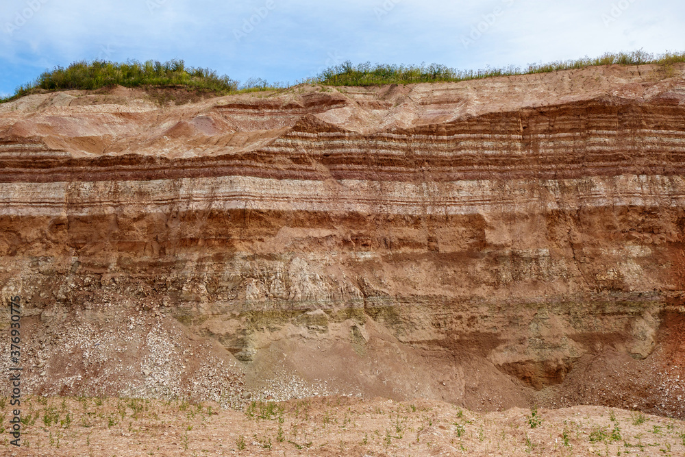 Surface of working wall in industrial quarry with opencast mining ...