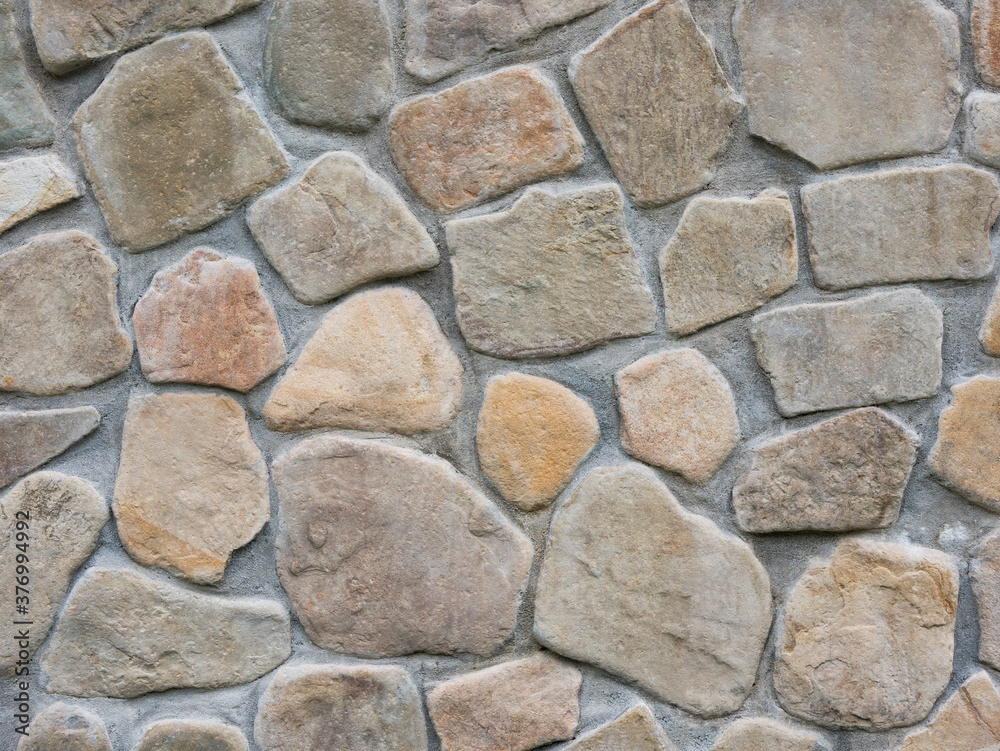 Seamless textured stone wall. Neatly stacked rough cobblestone wall ...