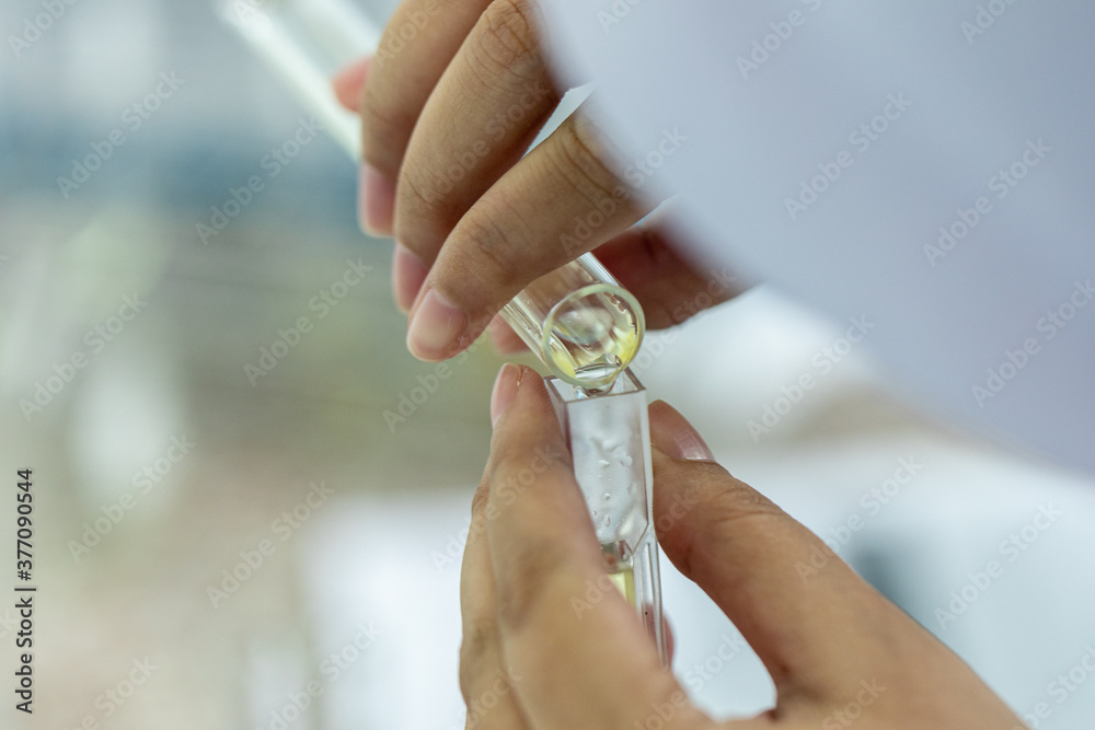 Sample analysis using Spectrophotometer for lab experiments. Stock ...