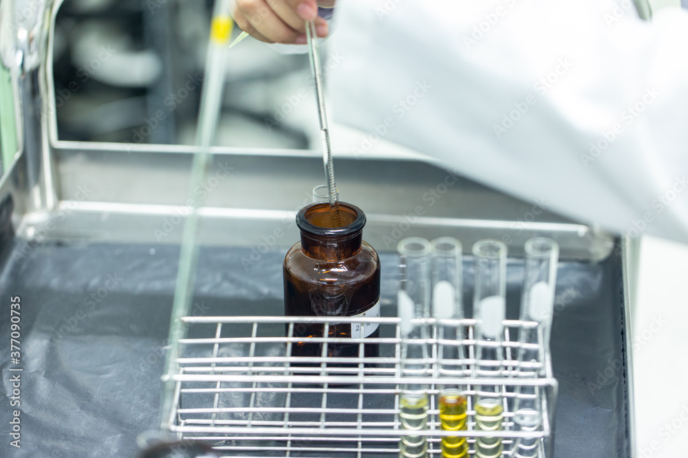 Sample analysis using Spectrophotometer for lab experiments. Stock ...