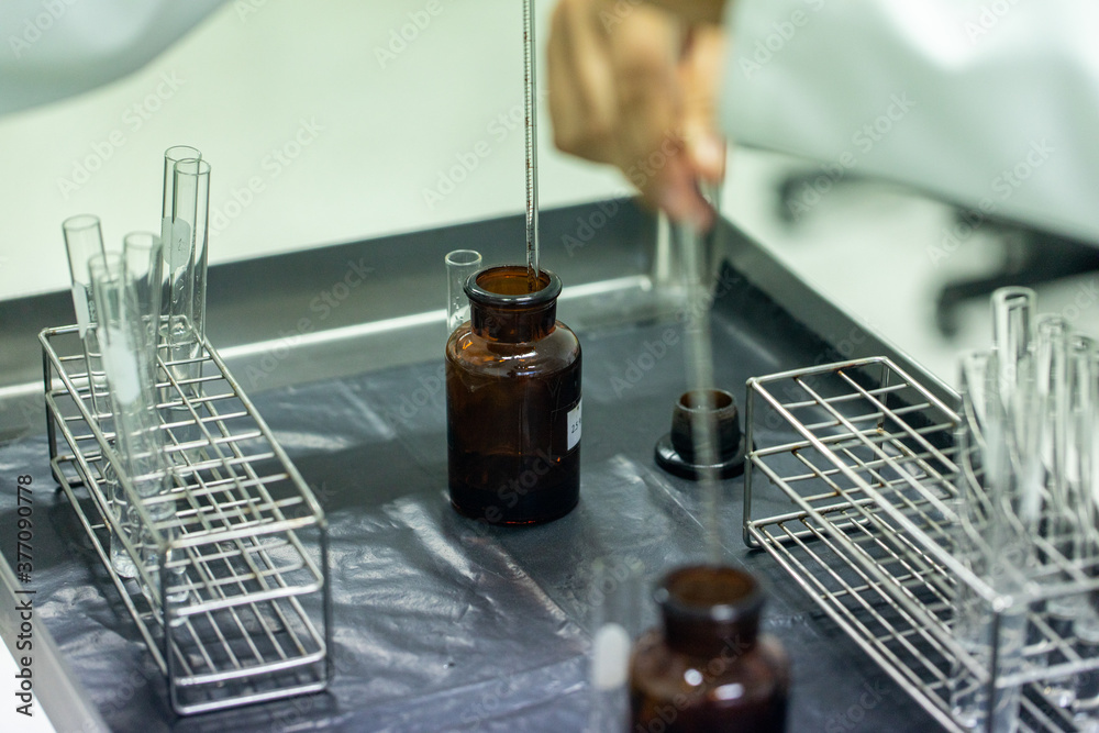 Sample analysis using Spectrophotometer for lab experiments. Stock ...