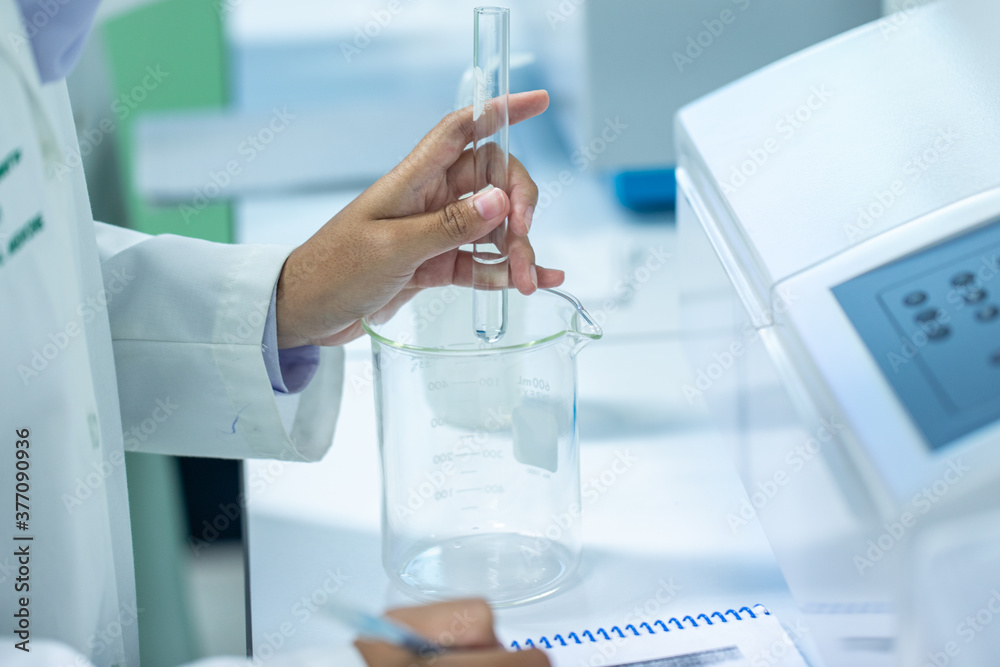 Sample analysis using Spectrophotometer for lab experiments. Stock ...