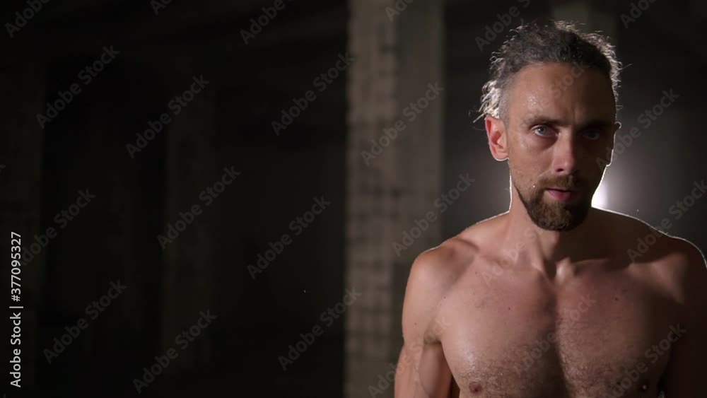 Bodybuilding man with dreadlocks portrait standing in front of the ...