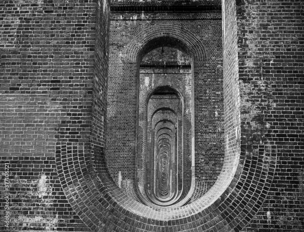 The Ouse Valley Viaduct, opened in 1841 near Balcombe, Sussex, supports ...