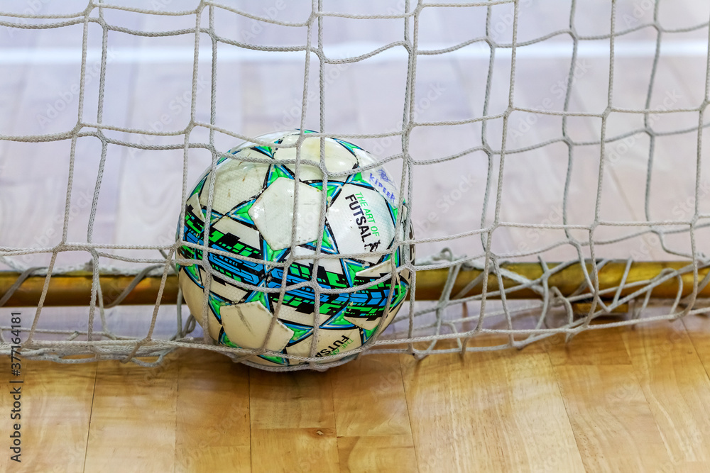 ODESSA, UKRAINE-CIRCA-2020: Soccer ball in the futsal goal net. Sports ...