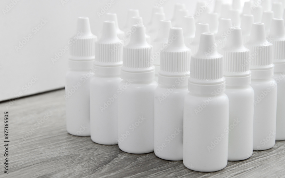 White bottles. Medical drops. Packaging for nal or ophthalmic drops ...