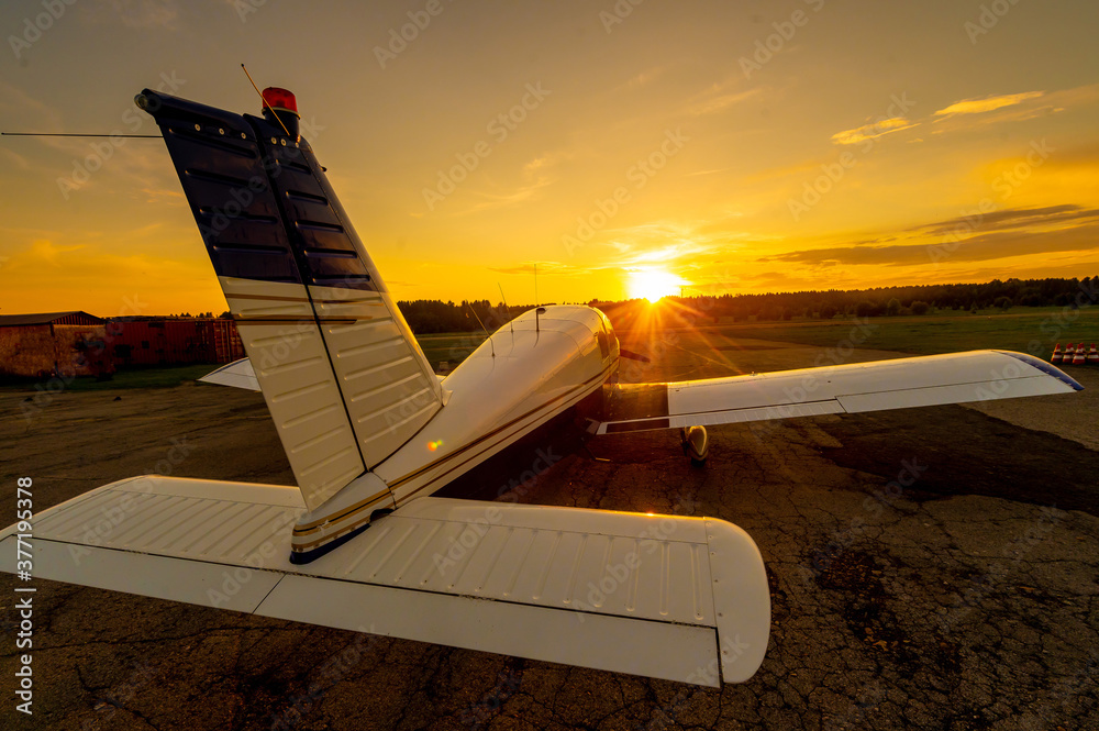 Quadruple aircraft parked at a private airfield. Rear view of a plane ...