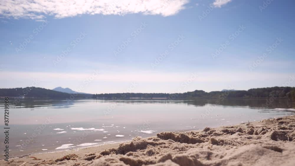 Man checking pulse trace on heartbeat monitor while running in water of ...