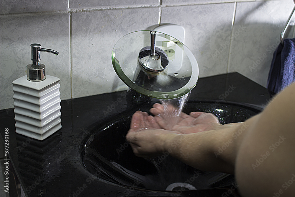 hand washing in the covid-19 coronavirus pandemic Stock Photo | Adobe Stock