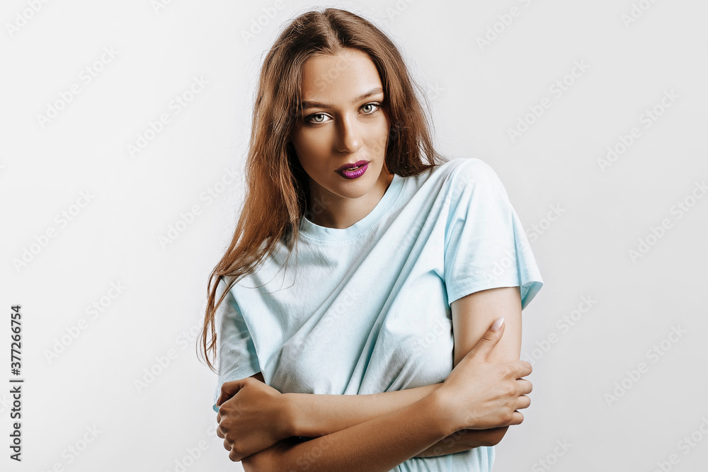 The Woman Crossed Her Arms Over Her Chest Beautiful Young Brunette