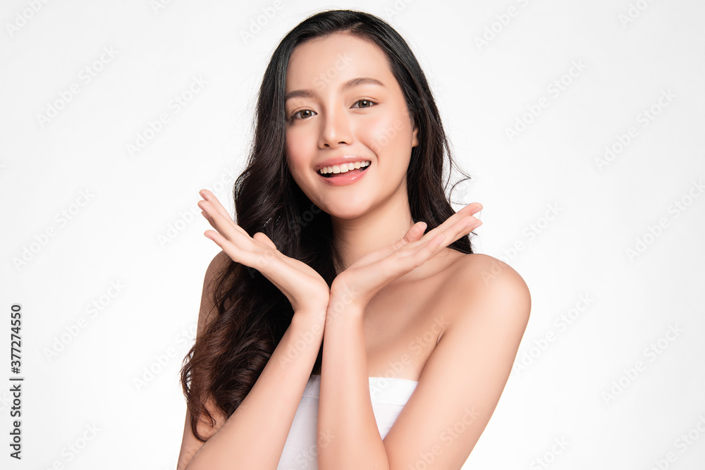 Beautiful young asian woman with clean fresh skin on white background ...