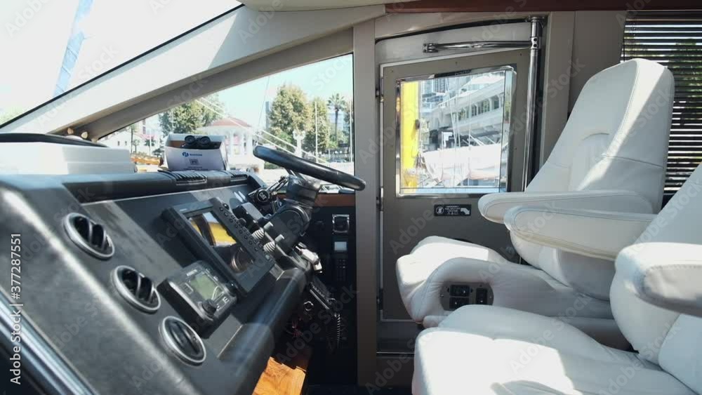 yacht with instruments and steering wheel the hands of the captain ...