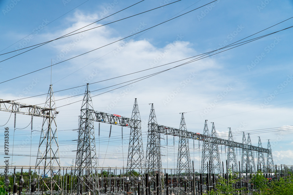 3 phase electrical high voltage substation with blue sky and clouds in ...